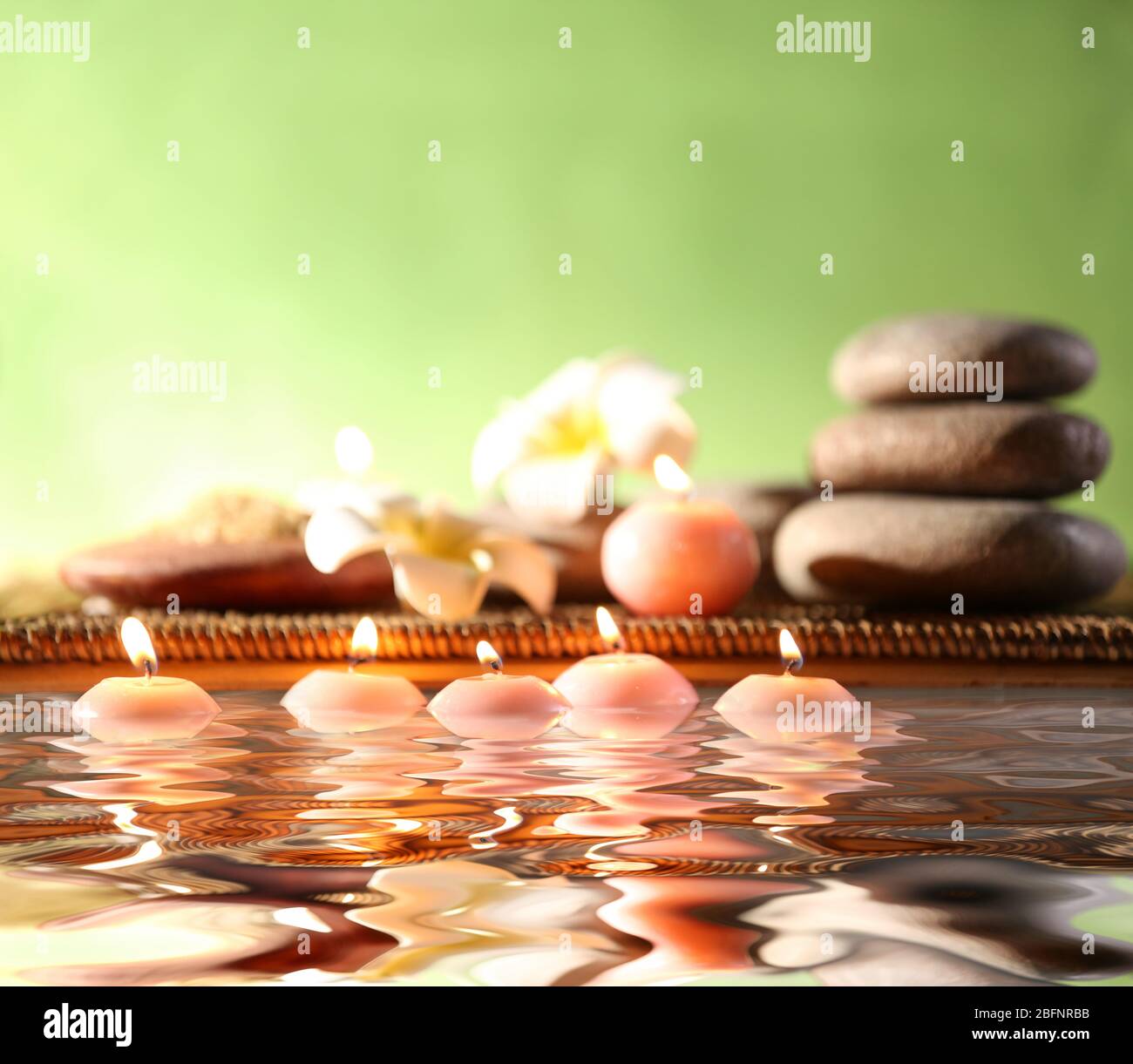 Beautiful spa composition with reflection on water surface Stock Photo ...