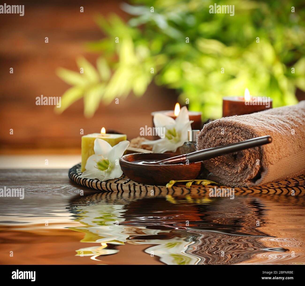 Beautiful spa composition with reflection on water surface Stock Photo ...