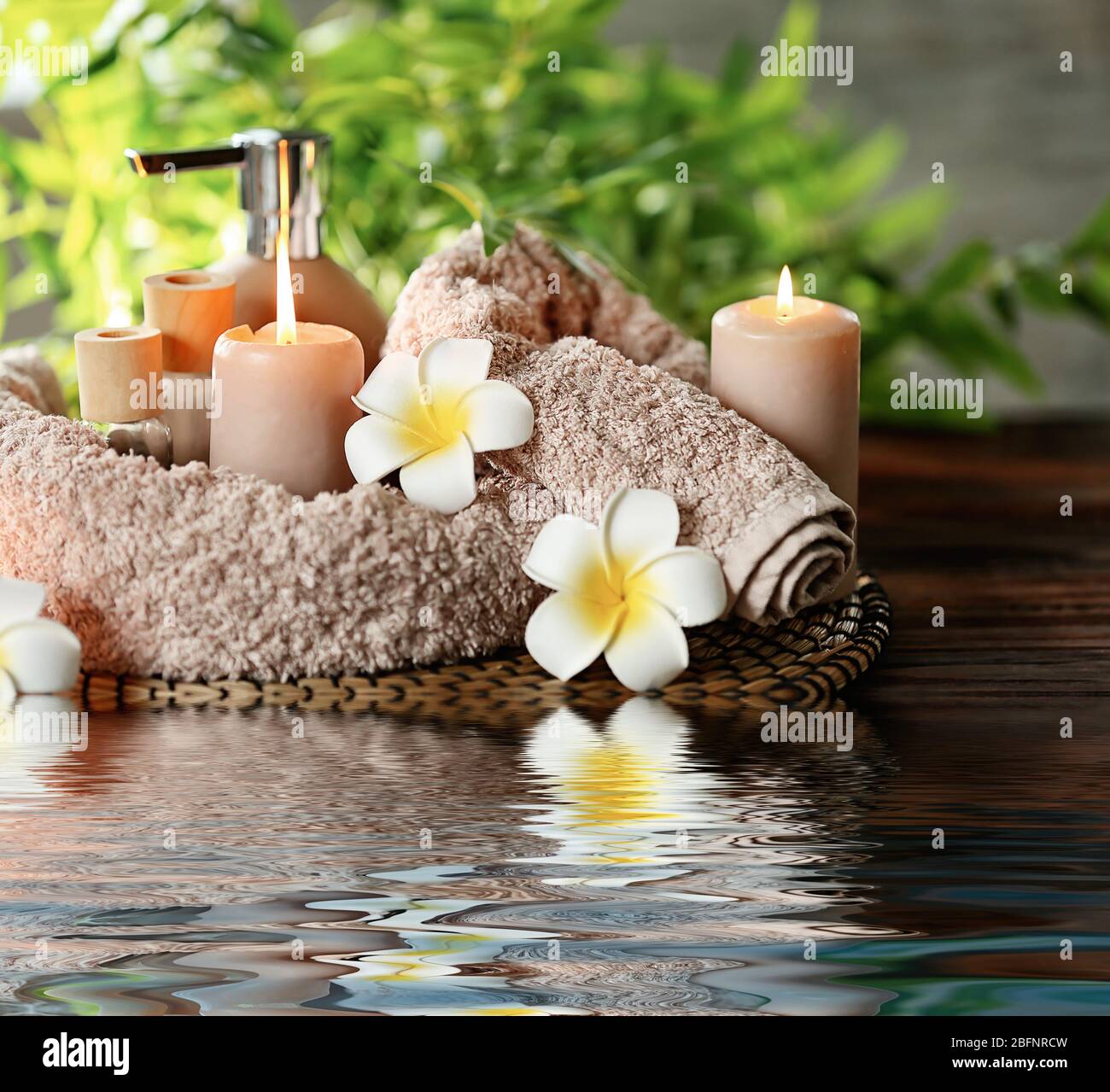 Beautiful spa composition with reflection on water surface Stock Photo ...