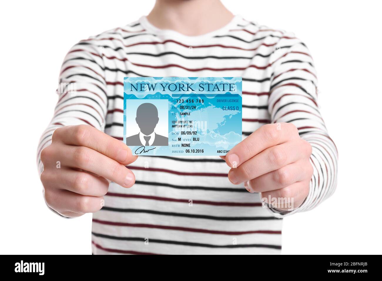 Man with driving license on white background Stock Photo - Alamy