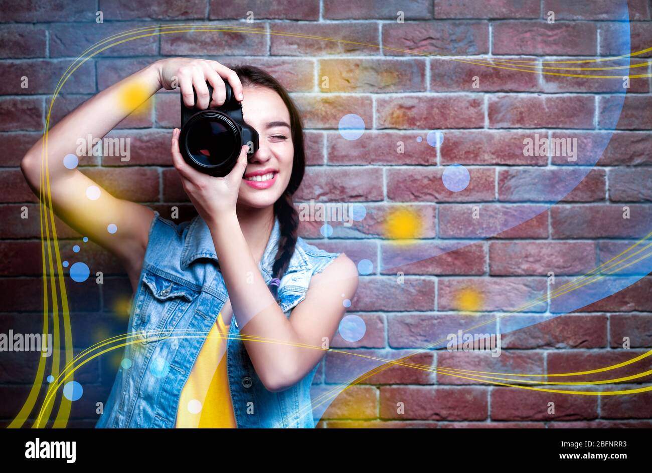 Professional photographer on brick wall background. Creative design ...