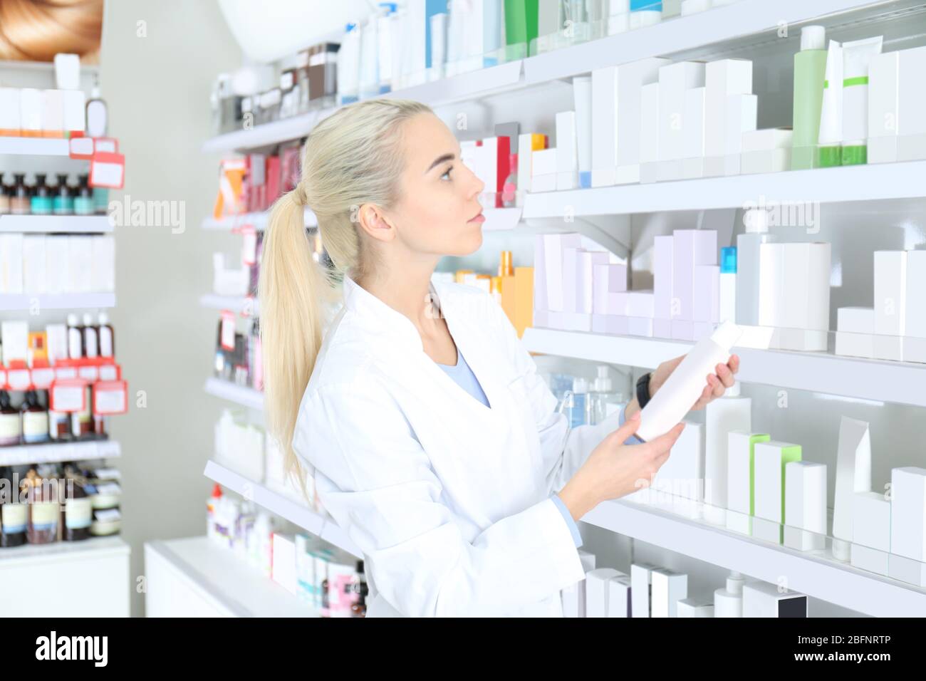 Female shop assistant at work Stock Photo - Alamy