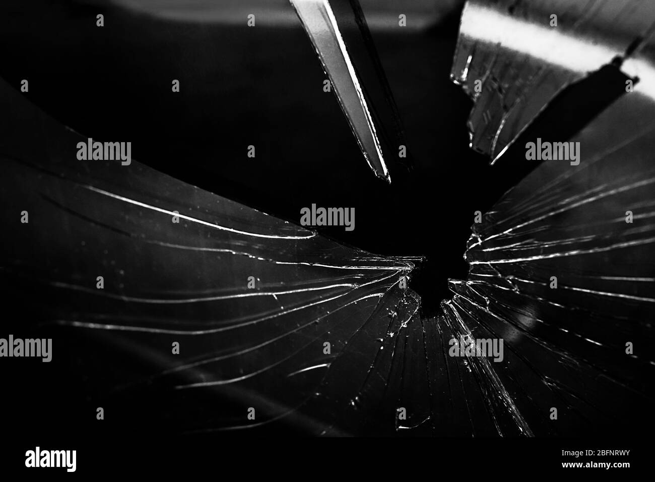 Broken glass with an unknown object Stock Photo - Alamy