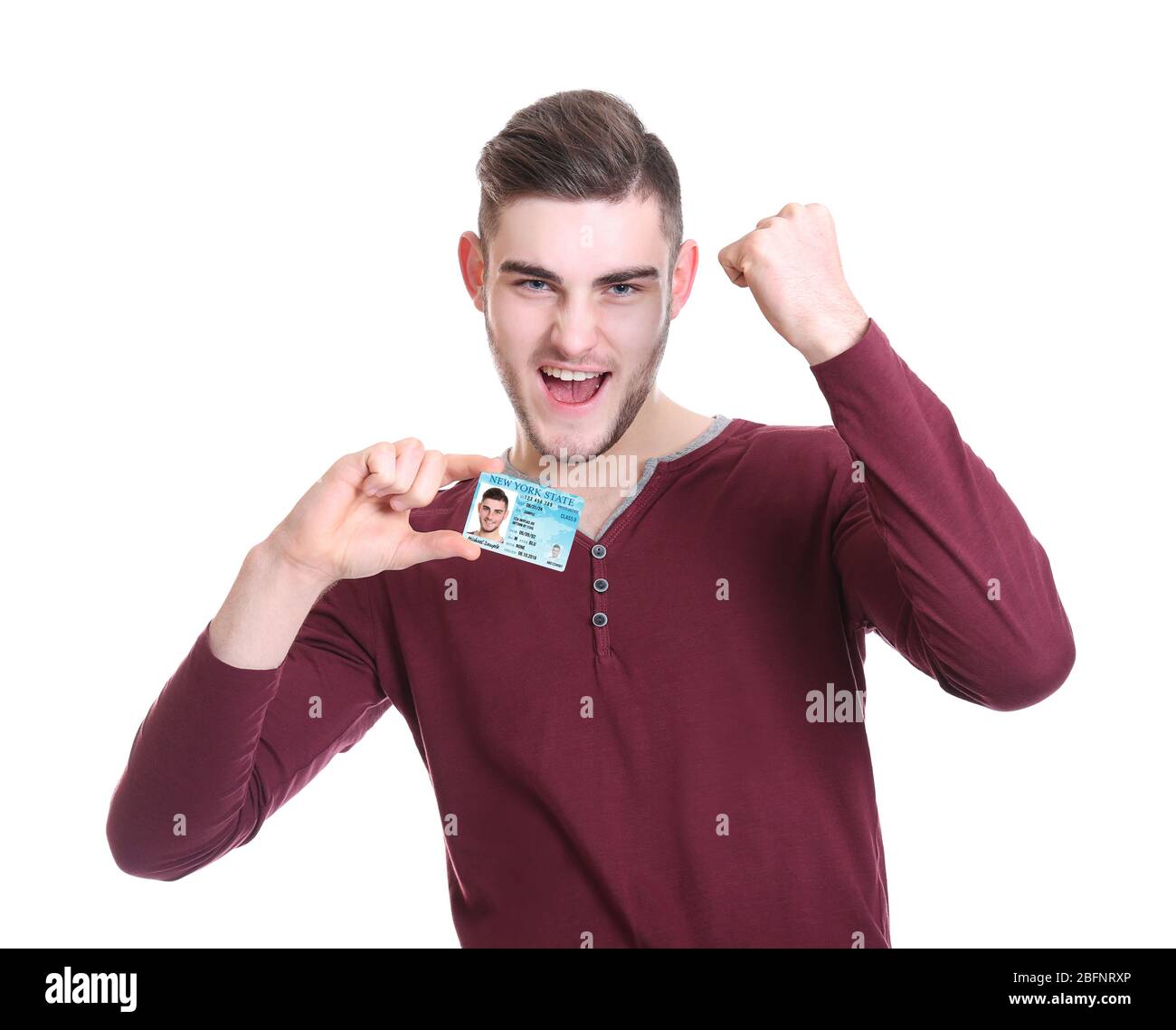 Man with driving license on white background Stock Photo - Alamy