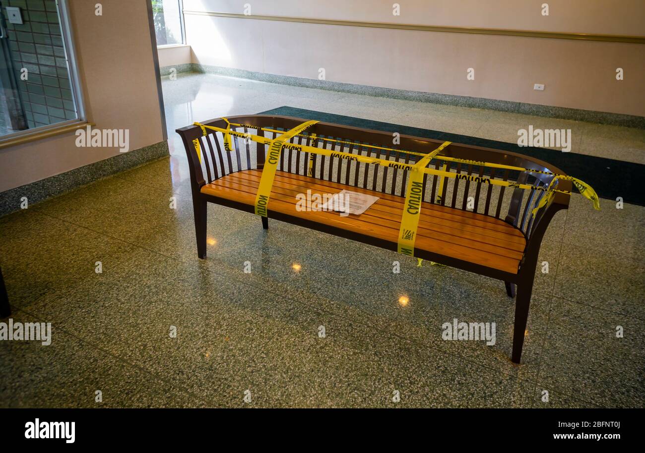 Benches in the lobby of an apartment building in New York are taped ...