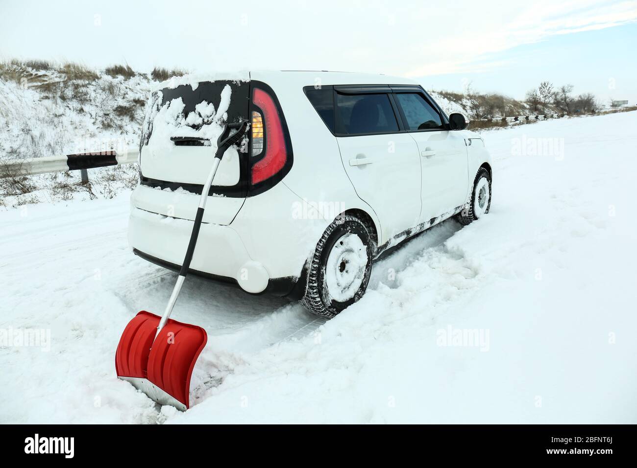 Car stuck in snowdrift on winter road Stock Photo - Alamy