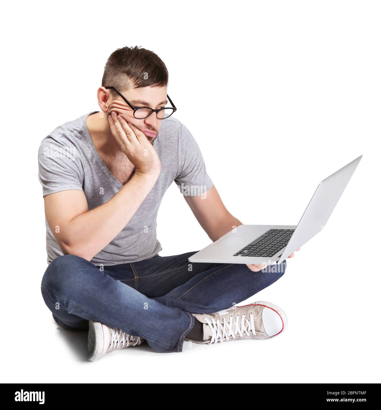 Handsome programmer with laptop on white background Stock Photo - Alamy