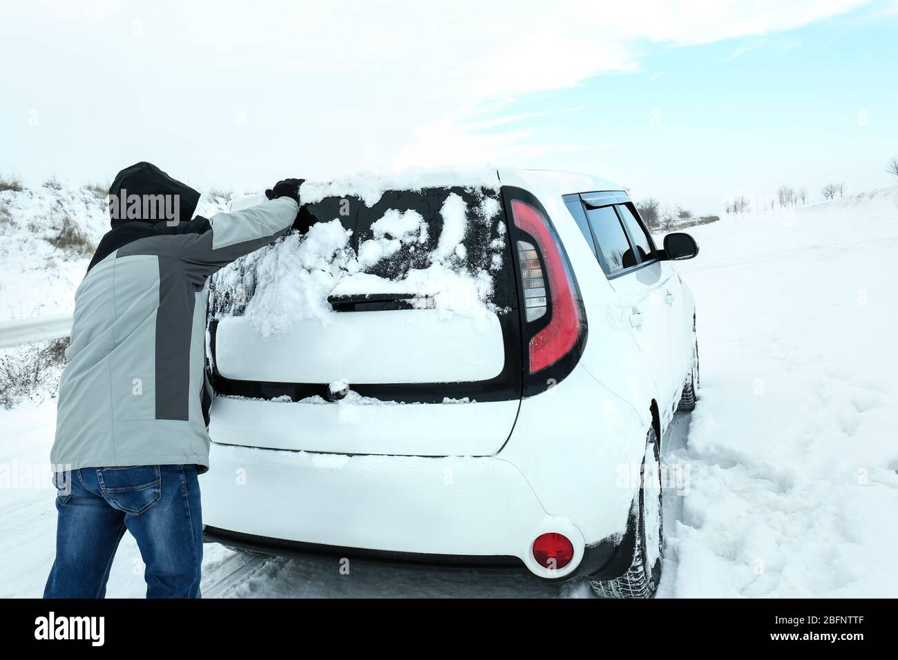 Pushing car in snow hi-res stock photography and images - Alamy