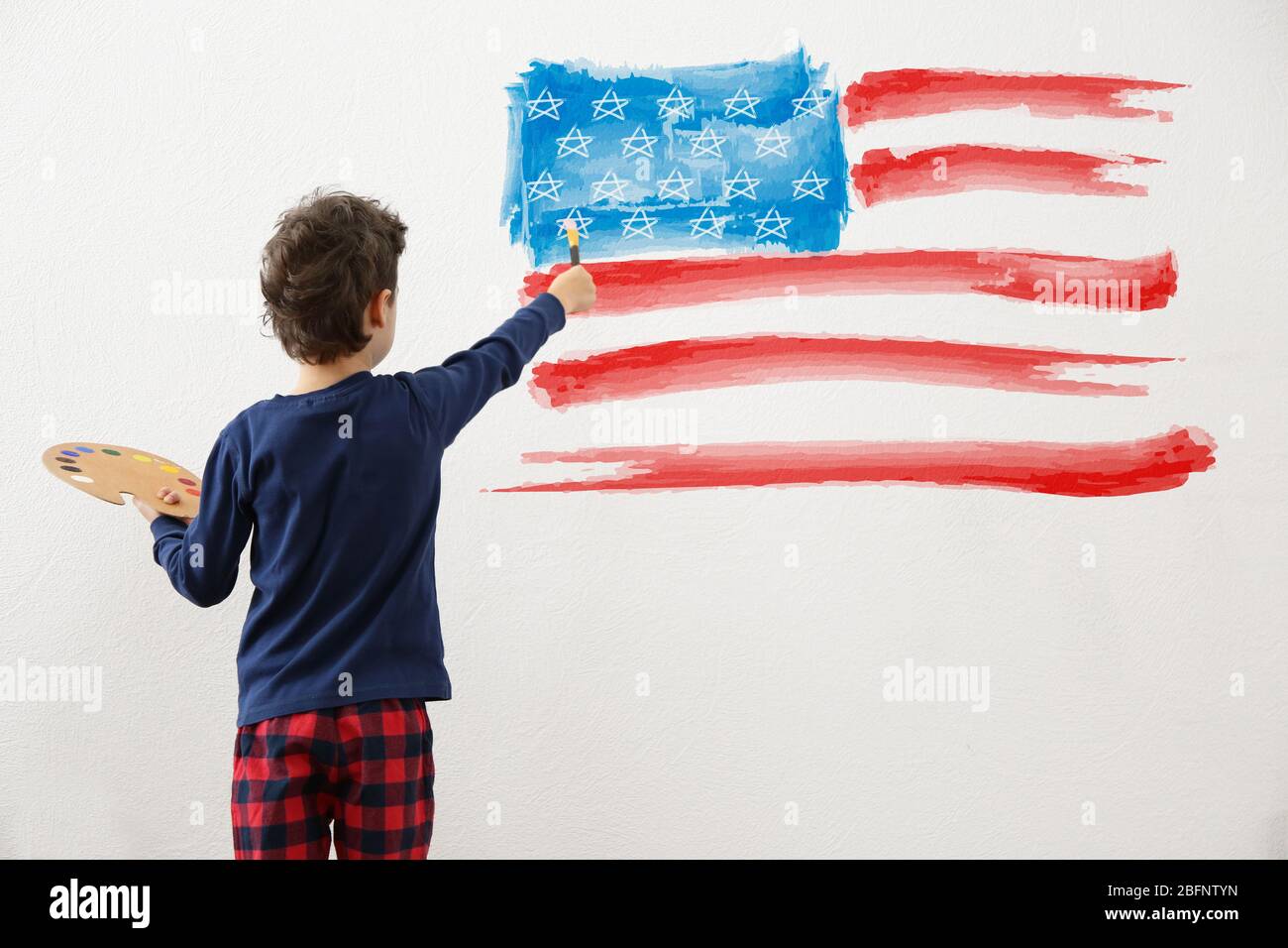 Little boy drawing USA flag on white background Stock Photo - Alamy