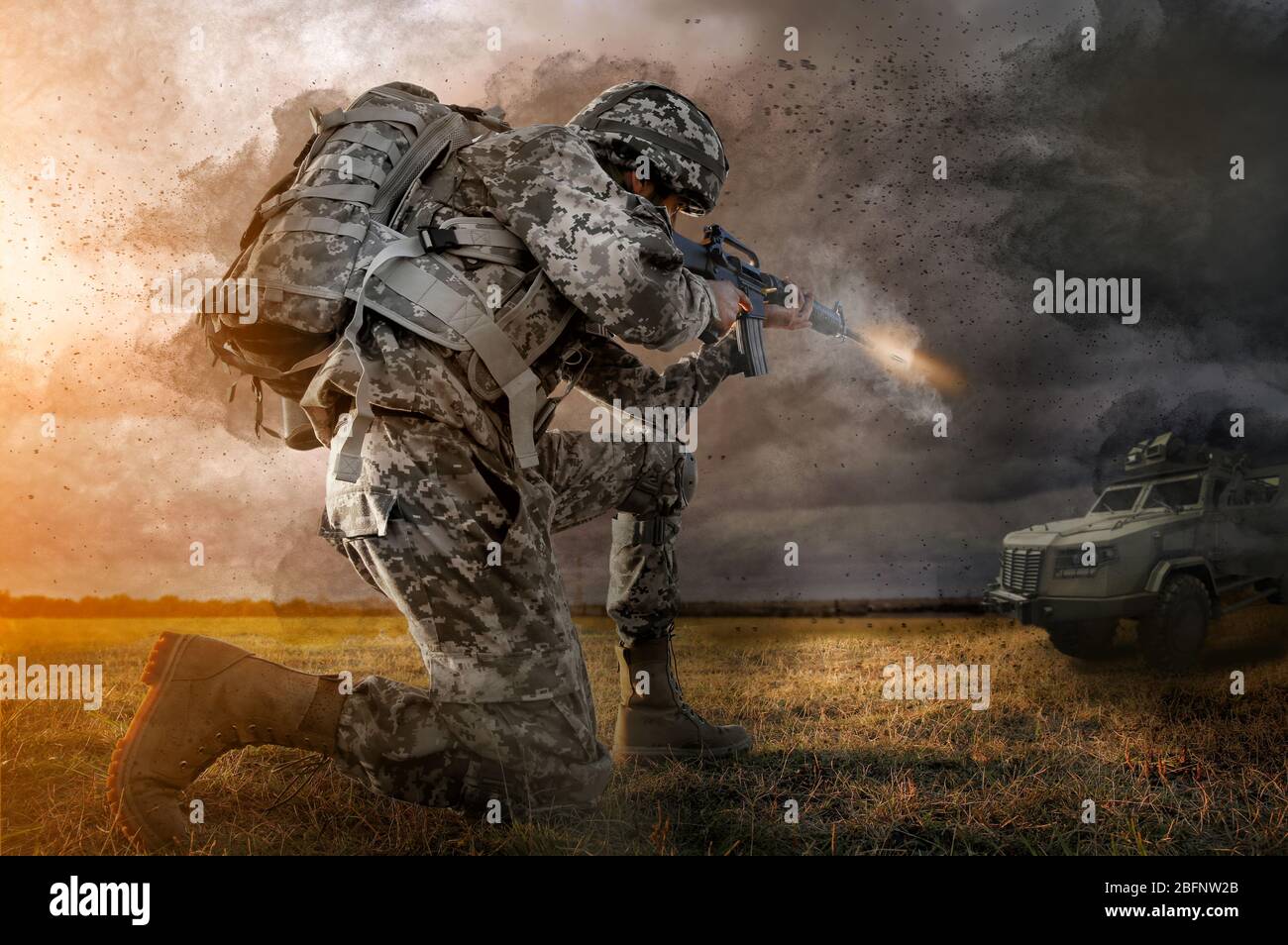 Soldier shooting from rifle on battlefield Stock Photo - Alamy