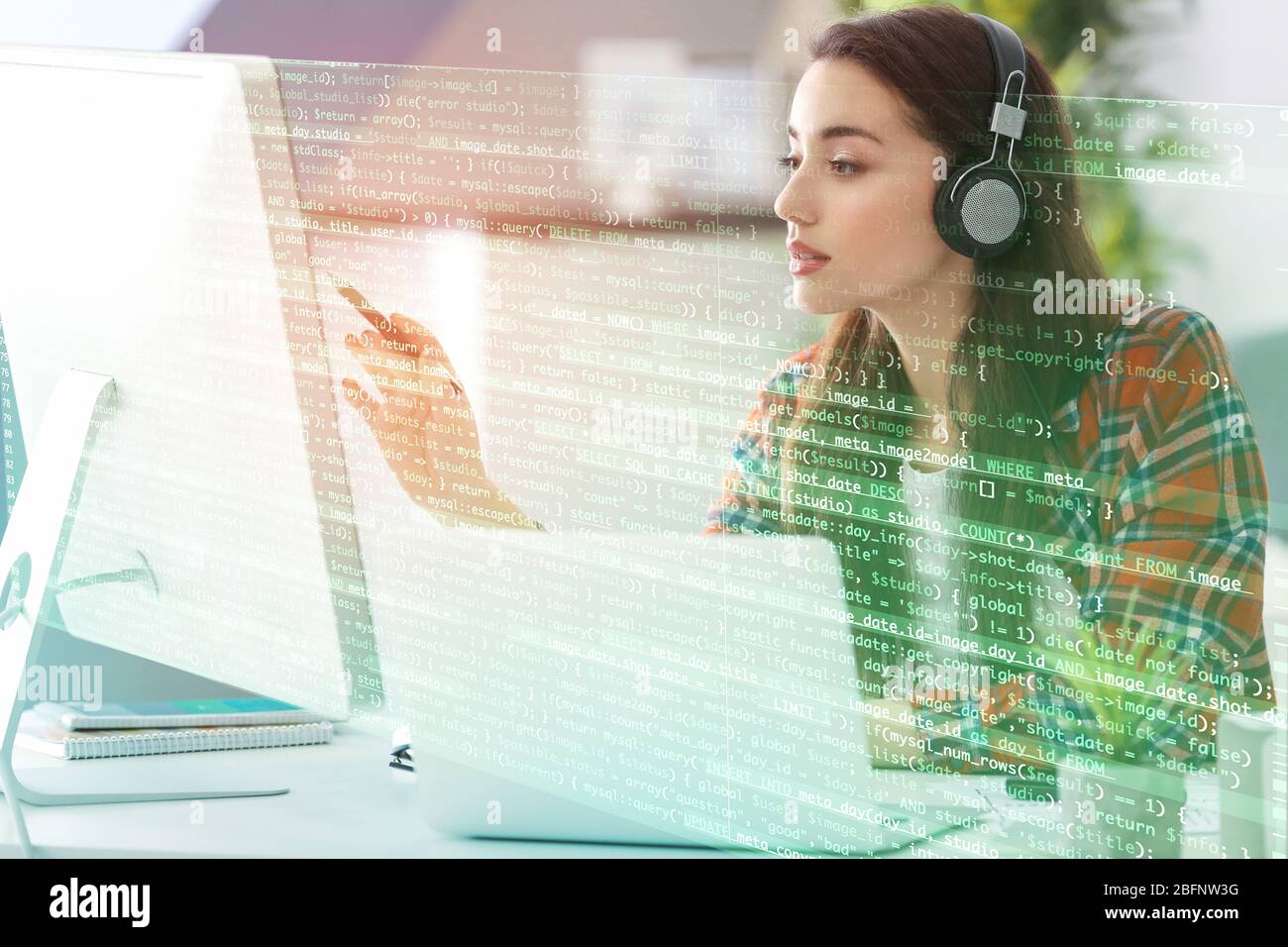 Program development concept. Young woman listening to music while ...