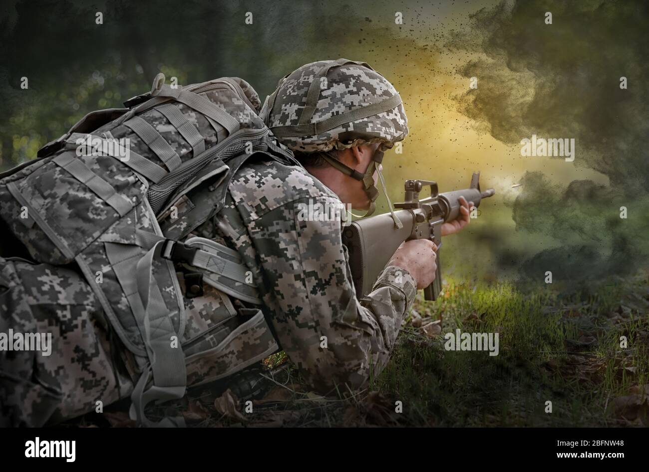 Soldier shooting from rifle on battlefield Stock Photo - Alamy
