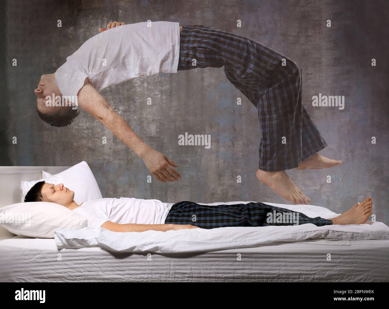 Young man suffering from sleep paralysis Stock Photo - Alamy