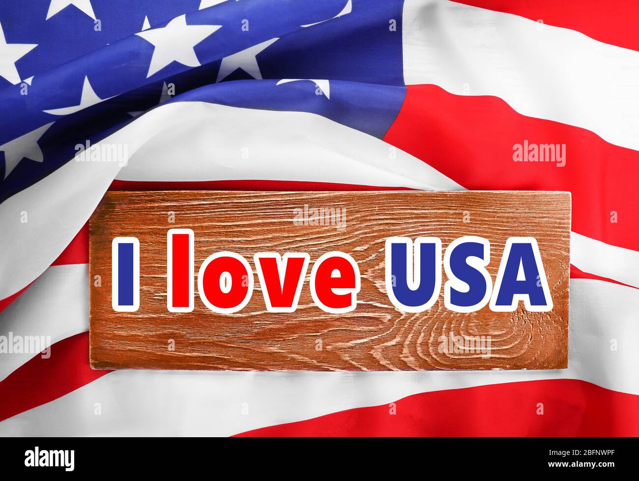 Wooden board with text I LOVE USA on American flag background Stock ...