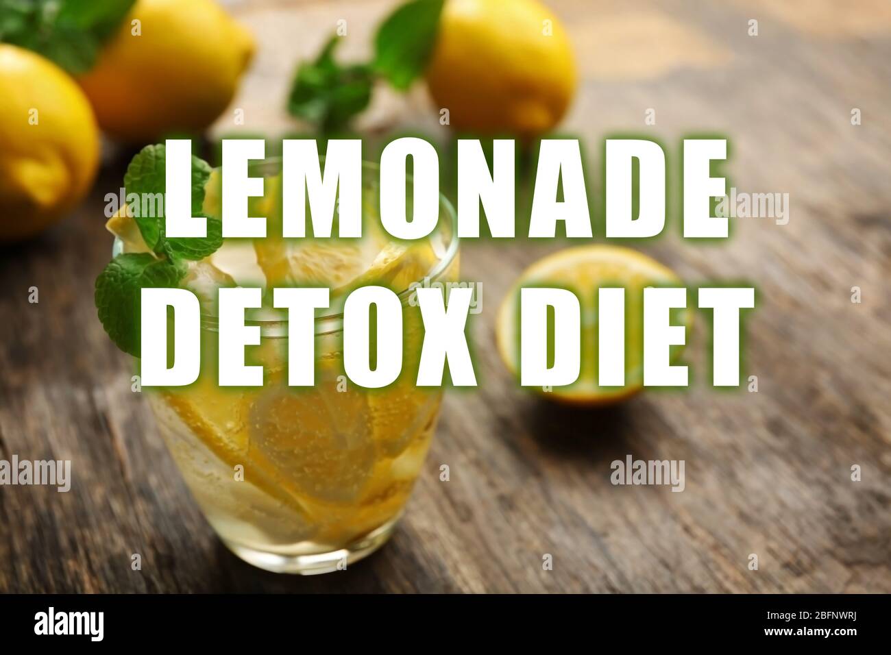 Lemonade detox diet concept. Glass of tasty drink on wooden background ...