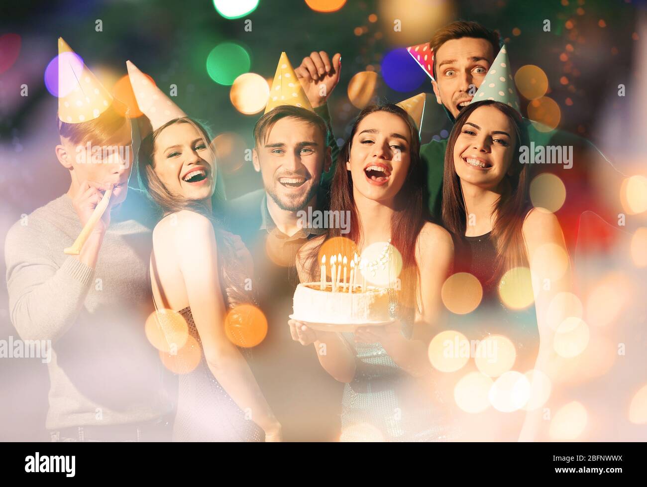 Young people having fun at birthday party in night club Stock Photo - Alamy