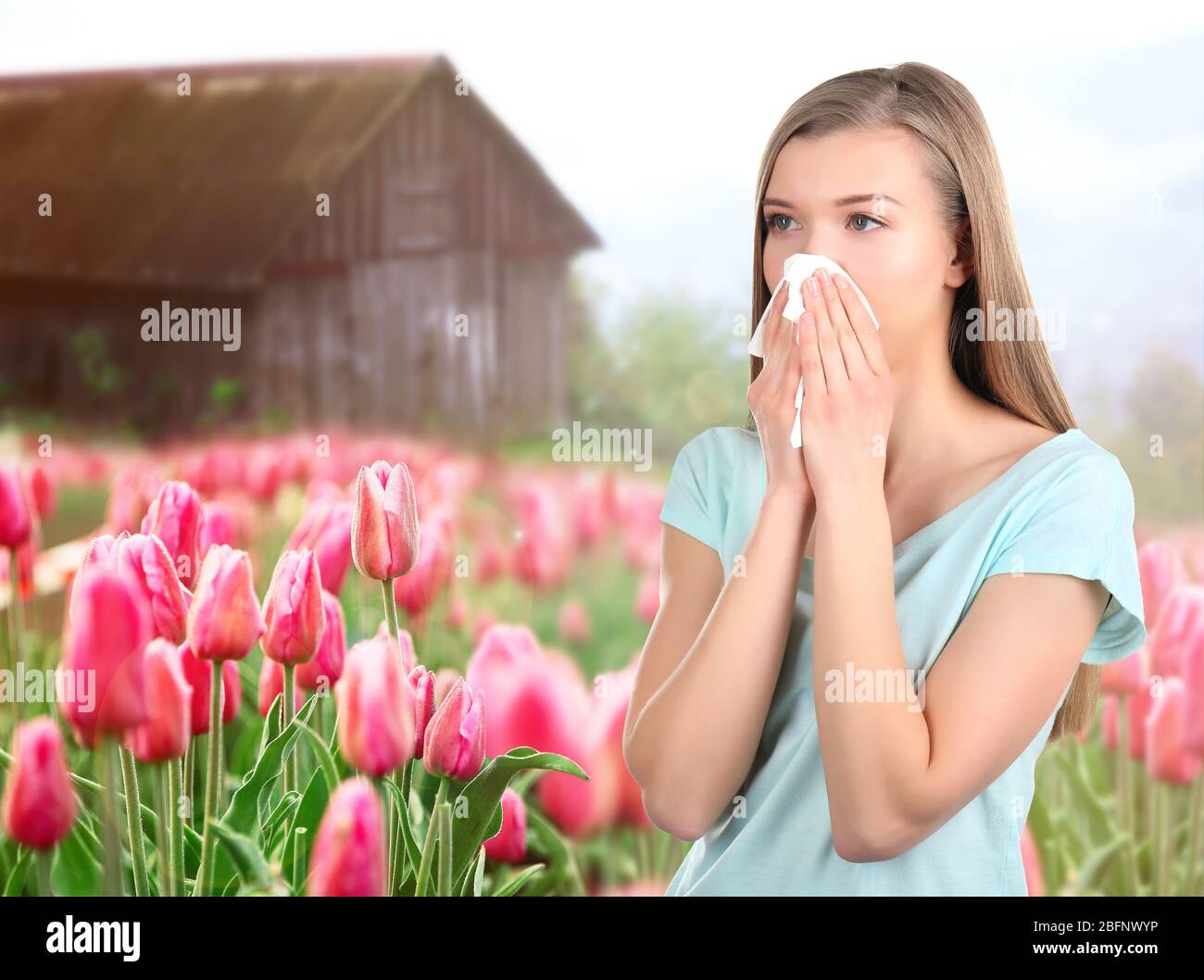 Seasonal allergy. Young woman with tissue outdoor Stock Photo - Alamy