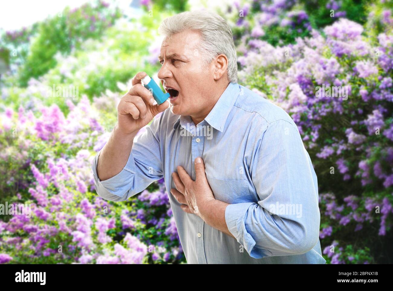 Senior man using asthma inhaler outdoor Stock Photo - Alamy