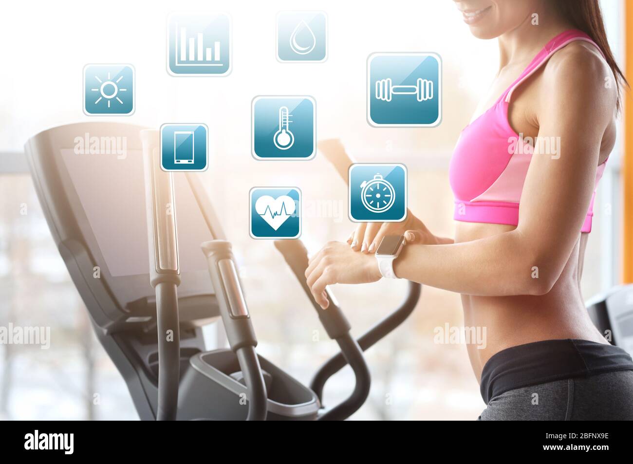 Sport application concept. Young woman with fitness tracker in gym ...