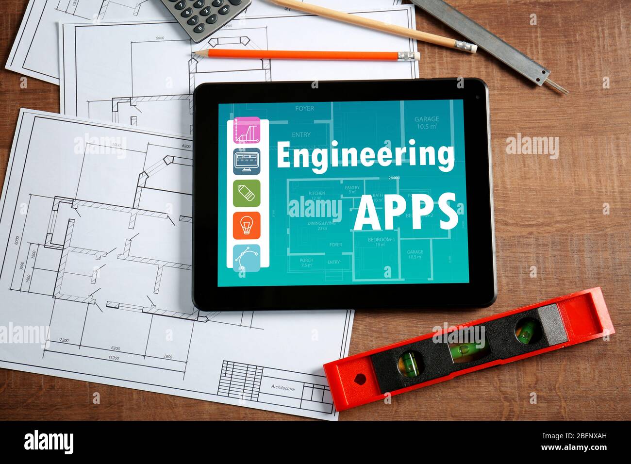 Engineering apps concept. Tablet with drawings on table Stock Photo - Alamy