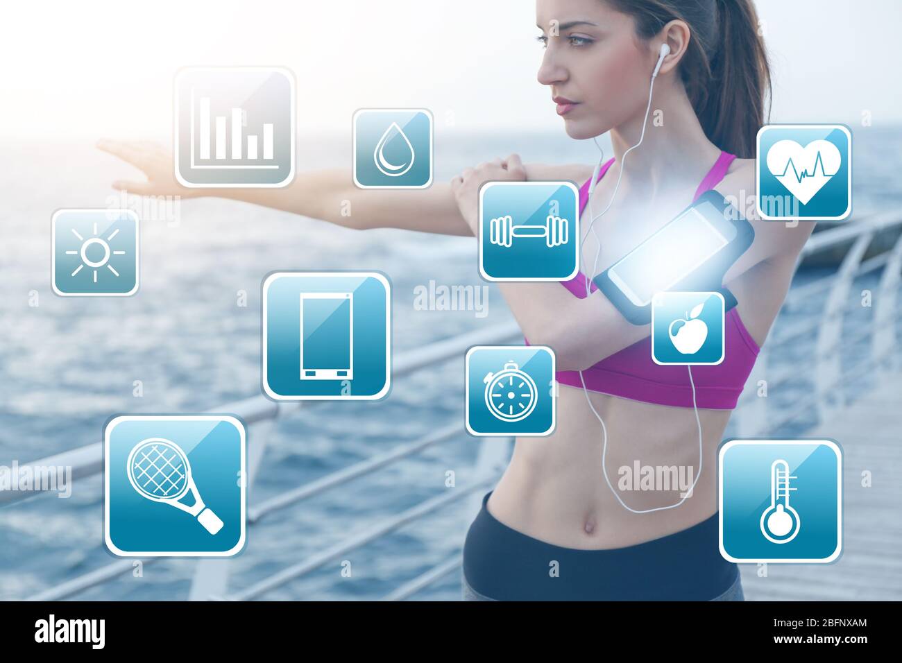 Sport application concept. Young woman training with smartphone outdoor ...