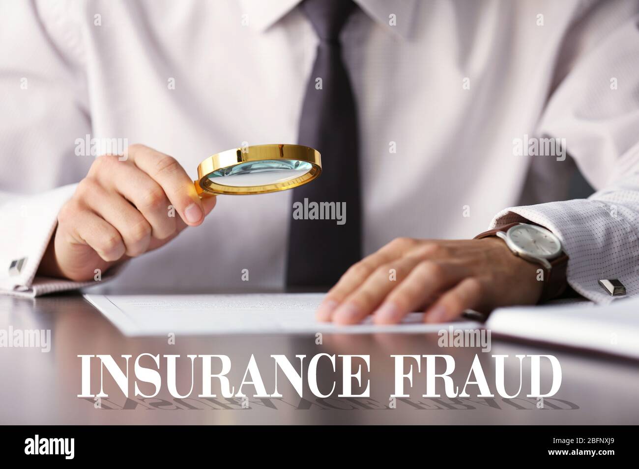 Insurance fraud concept. Man inspecting document with magnifier Stock ...