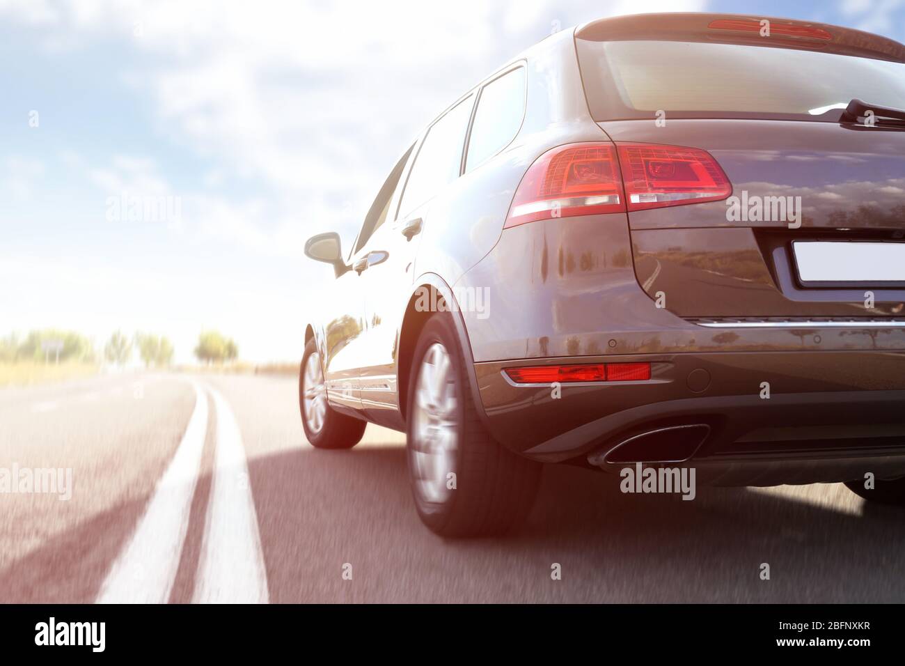 Car driving on road Stock Photo - Alamy