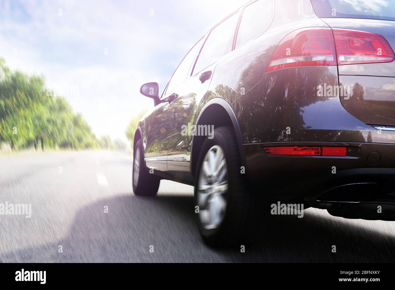 Car driving on road Stock Photo - Alamy