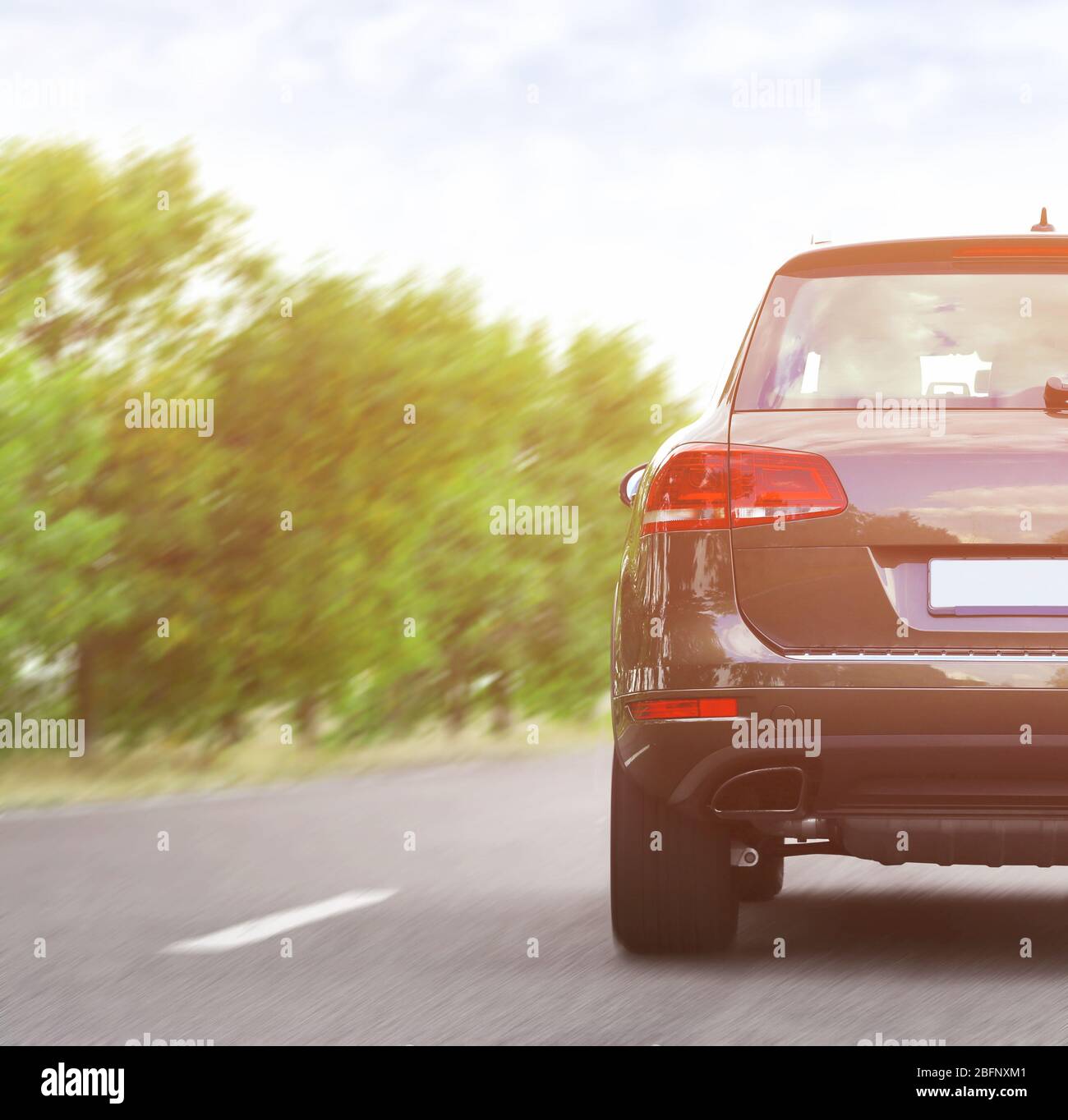 Car driving on road Stock Photo - Alamy