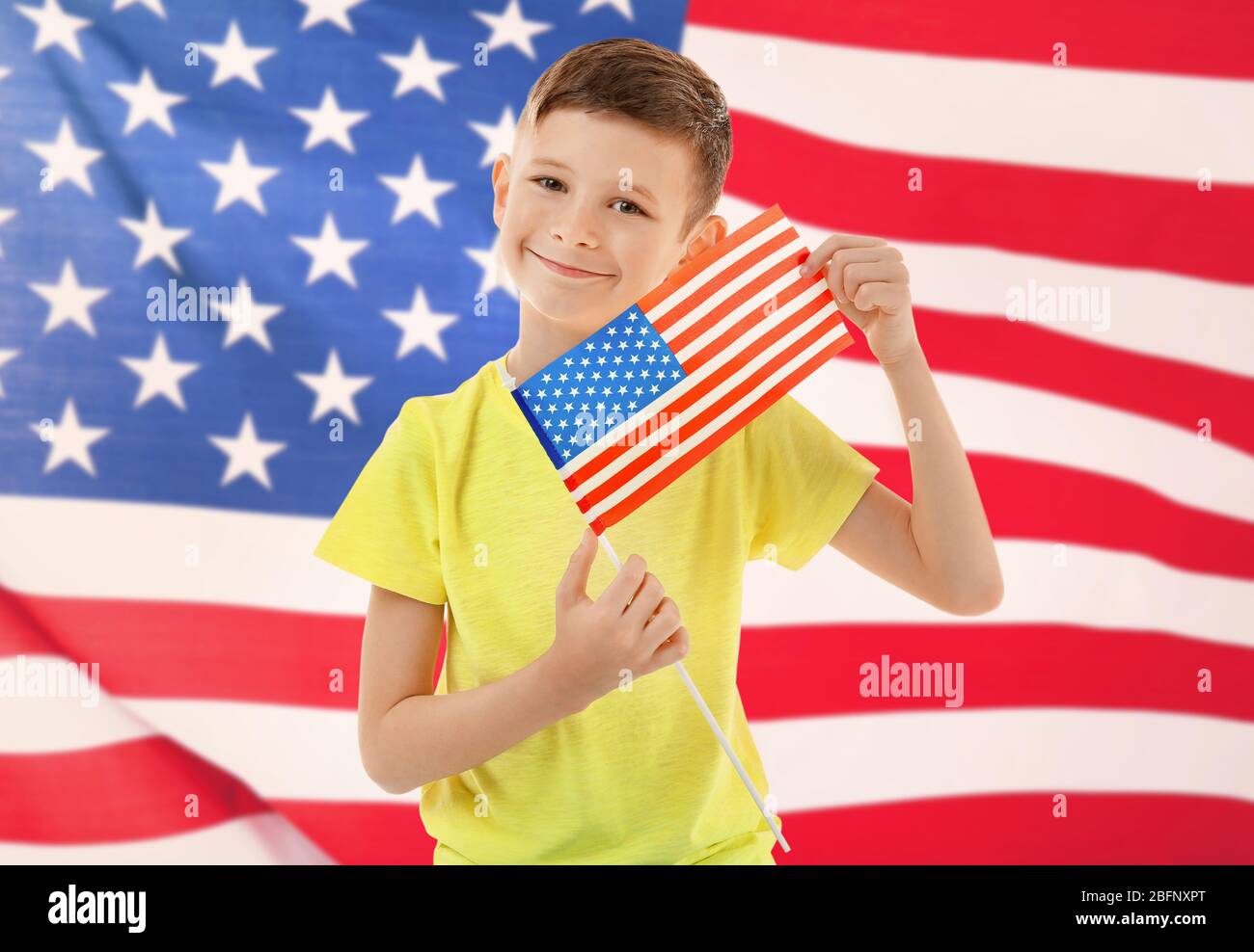 Little boy on USA flag background Stock Photo - Alamy