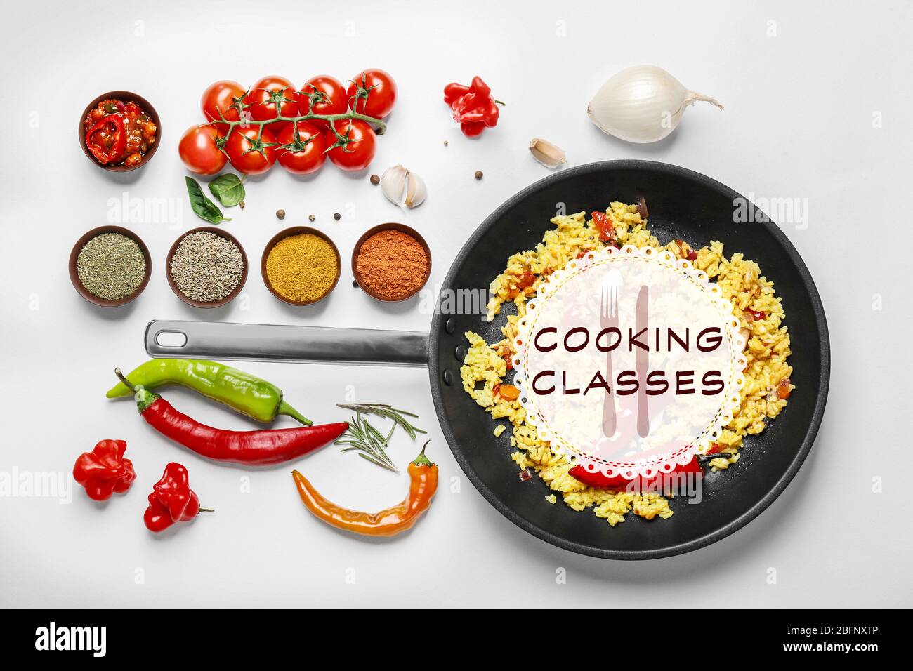 Cooking classes concept. Cooked rice in pan and ingredients on white ...