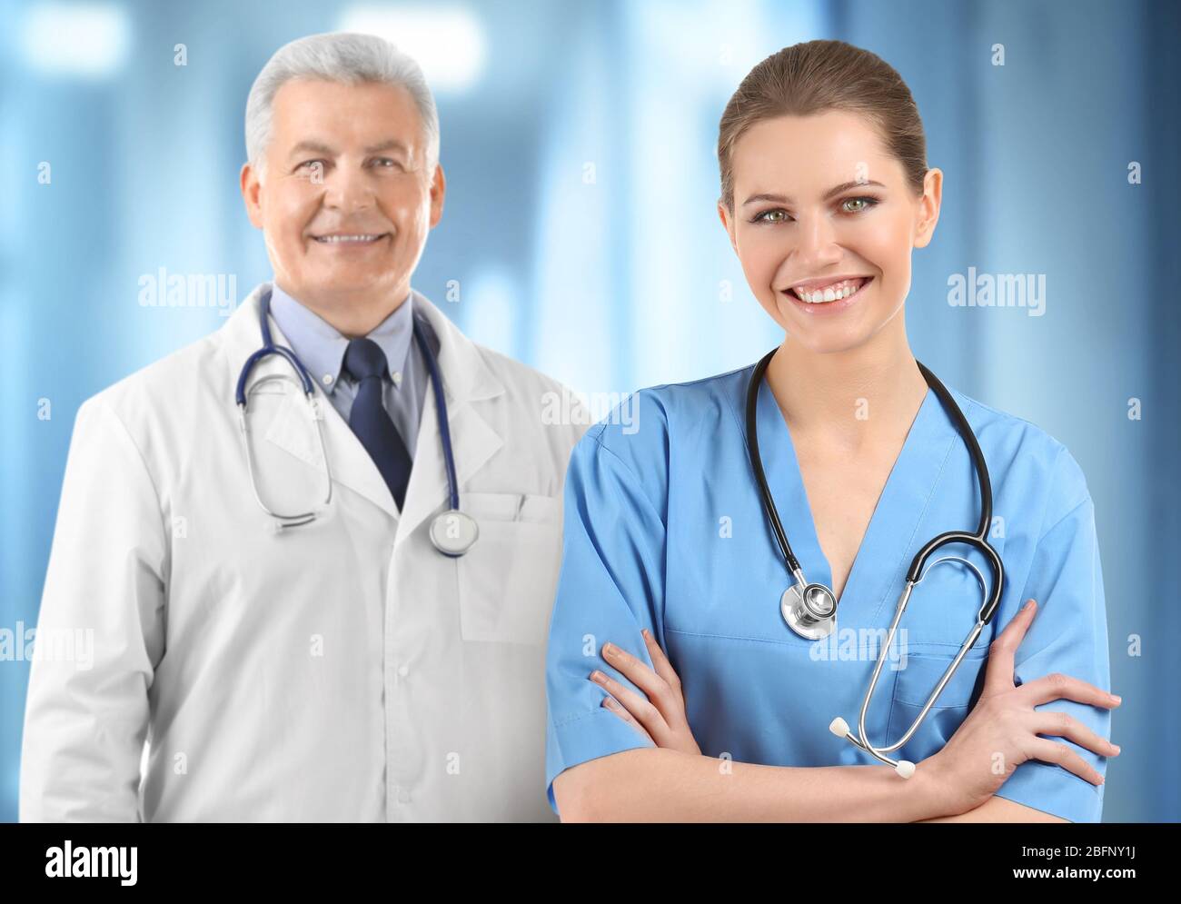 Medical staff on blurred hospital background Stock Photo - Alamy
