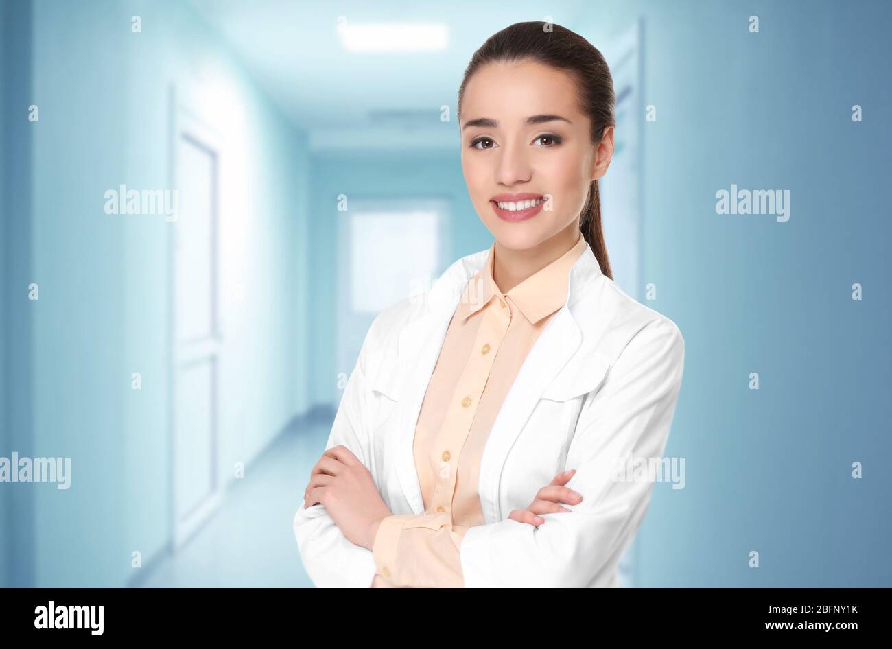 Doctor on blurred hospital background Stock Photo - Alamy