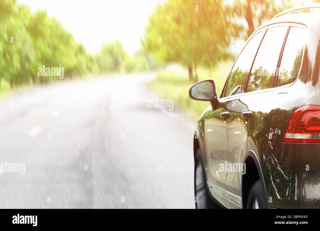 Car driving on road Stock Photo - Alamy
