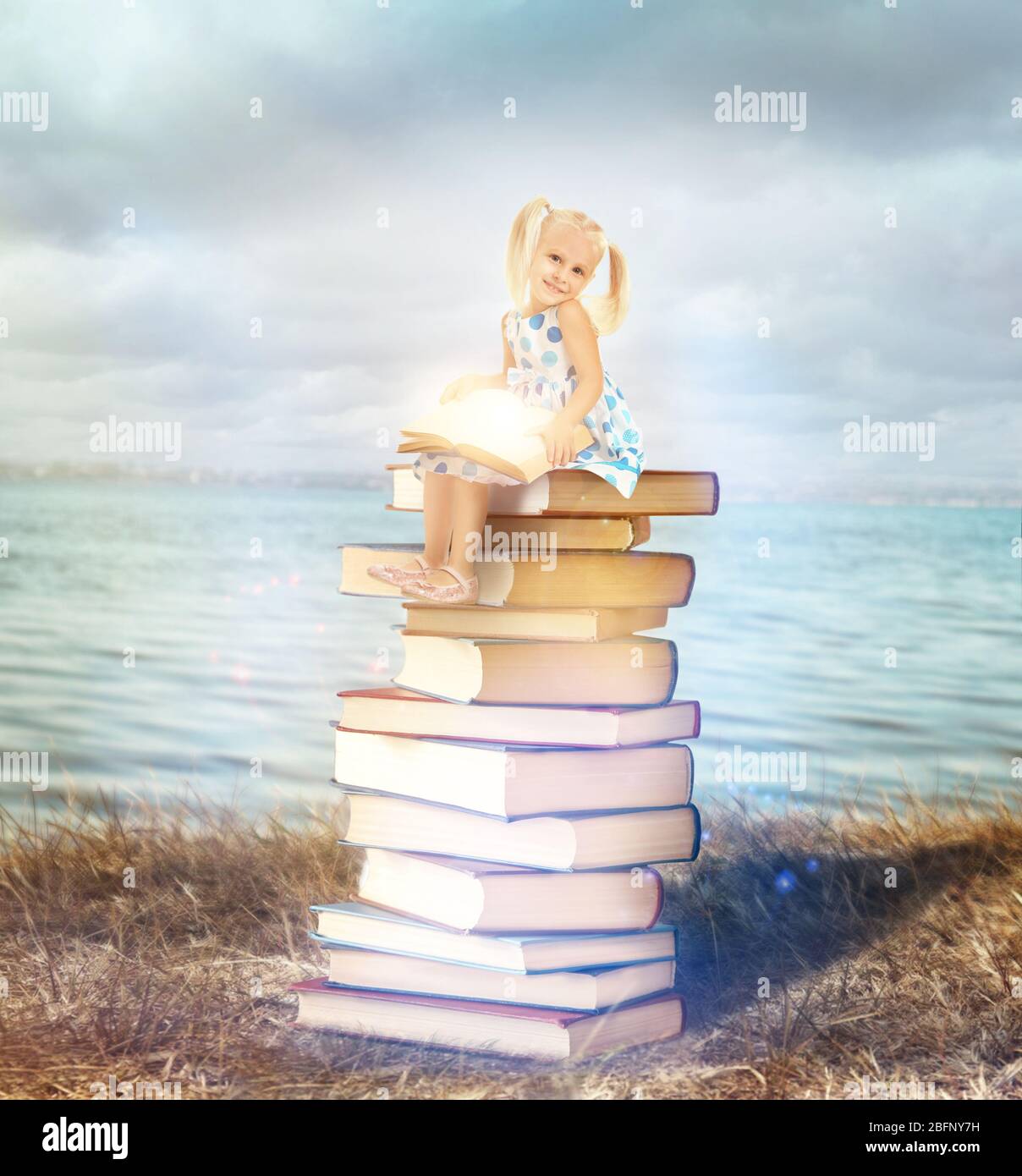 Adventure story and fairy tale. Tiny girl with books and magic glowing ...