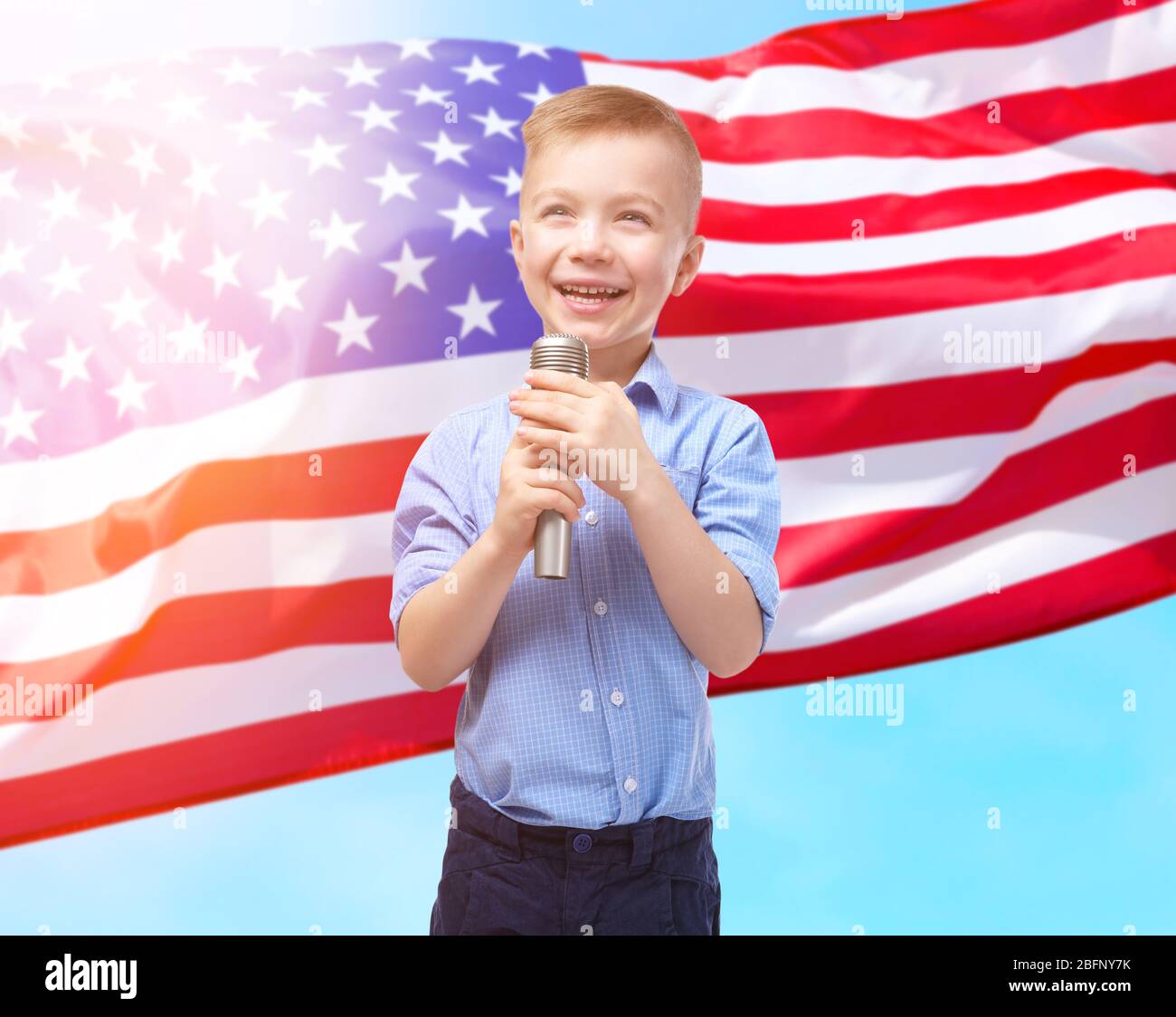 Little boy signing on USA flag background Stock Photo - Alamy
