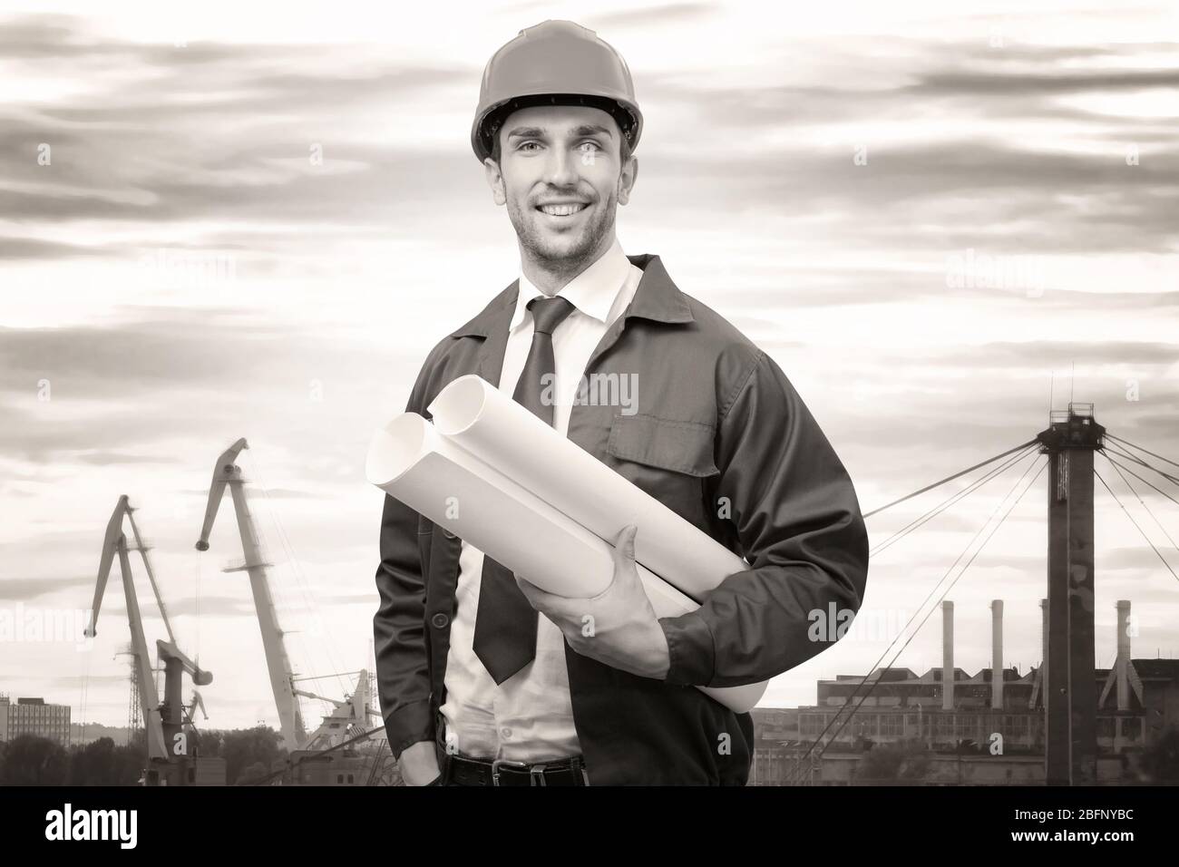 Engineer with project drawing on cityscape background Stock Photo - Alamy