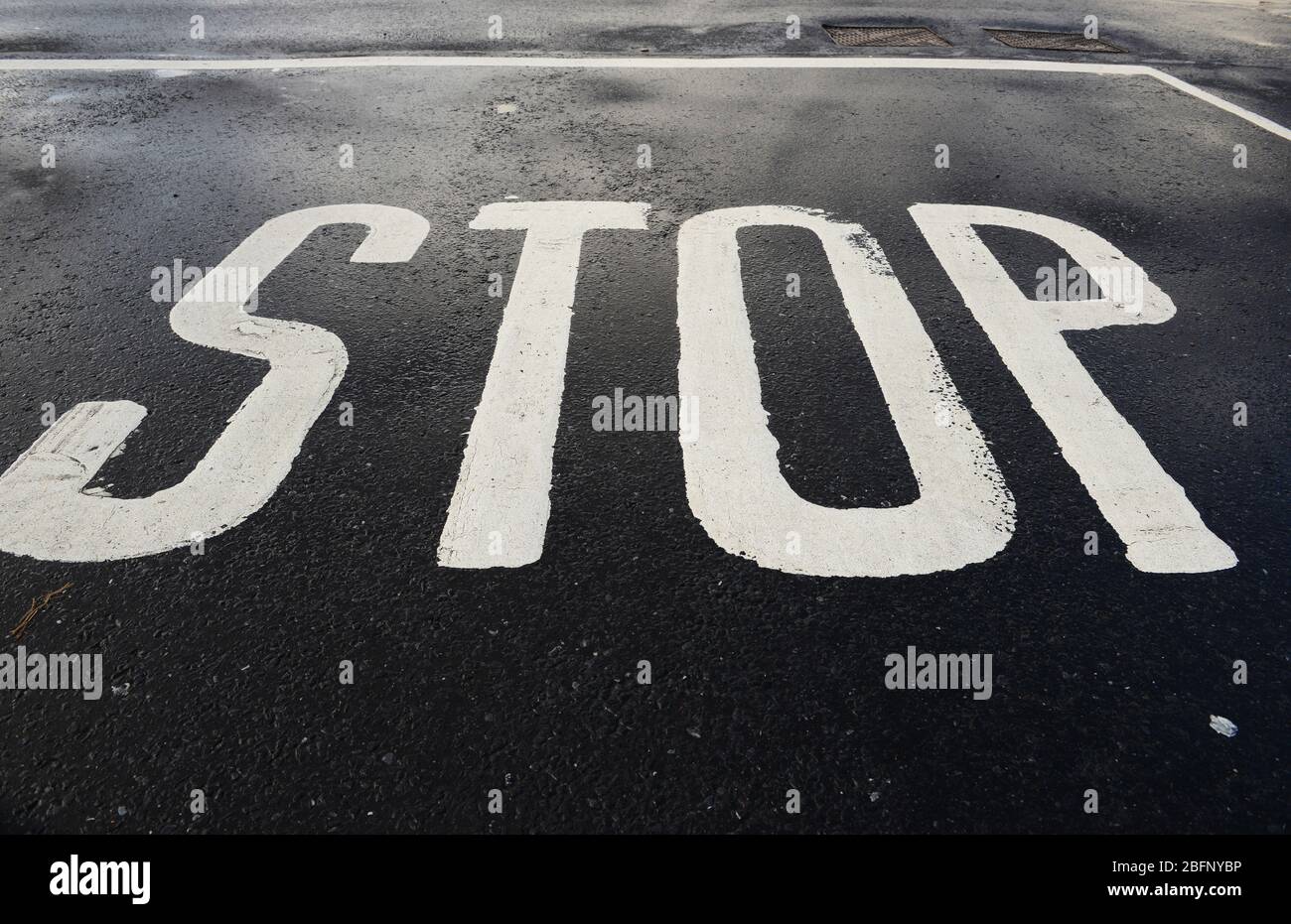 Close up of stop sign on road Stock Photo - Alamy