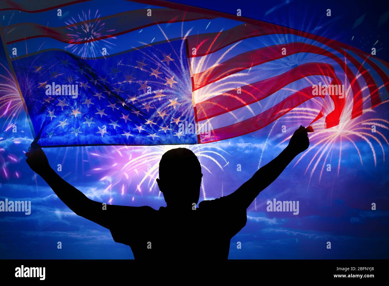 Little kid with American flag and fireworks in sky. Holiday celebration ...