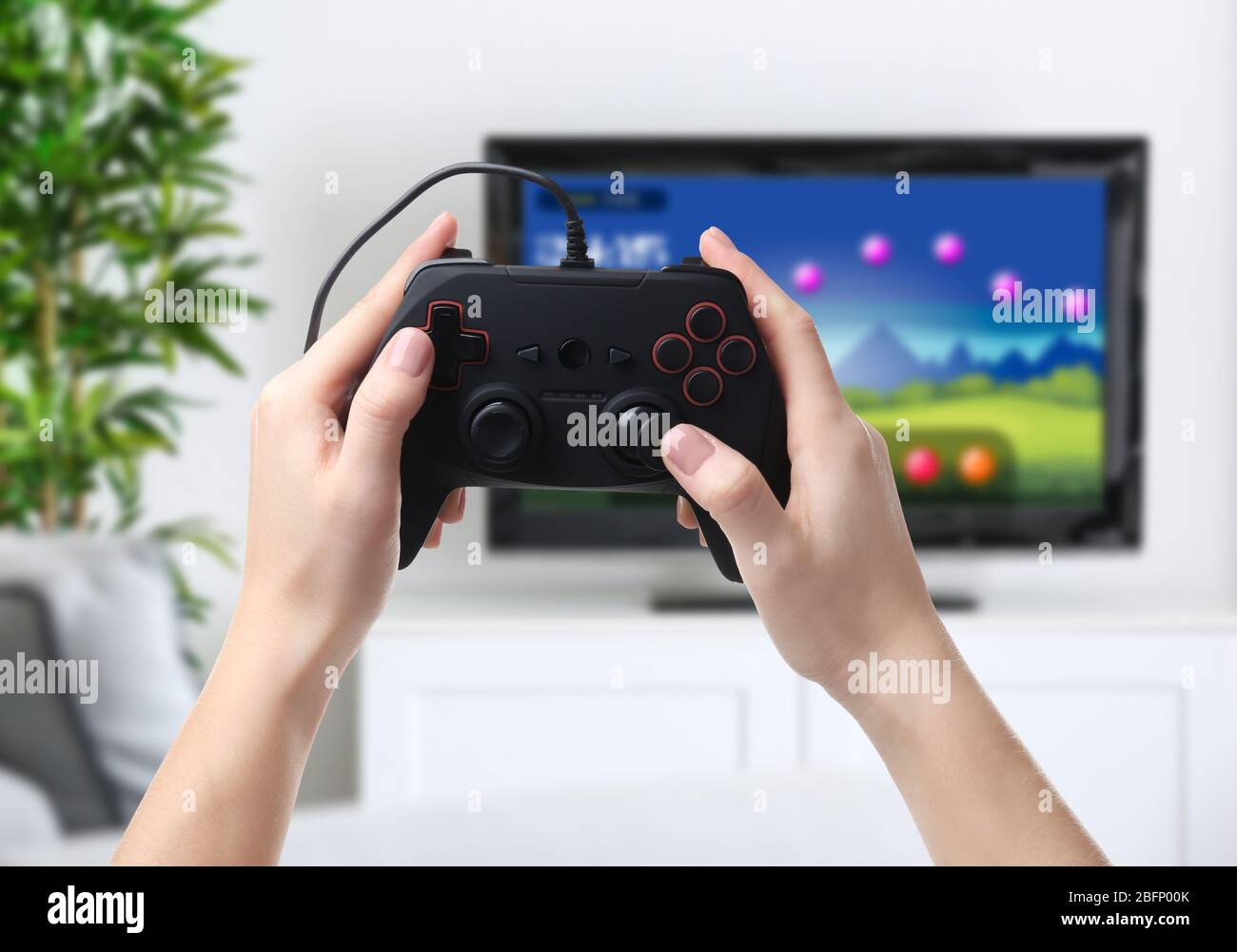 Woman controller entertainment game hi-res stock photography and images ...