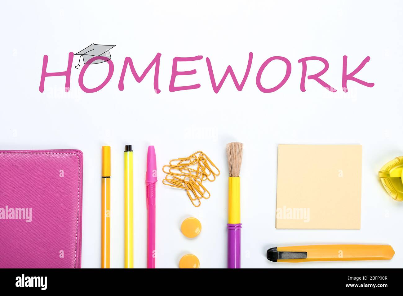 Composition with school supplies, word HOMEWORK and drawing of graduate ...