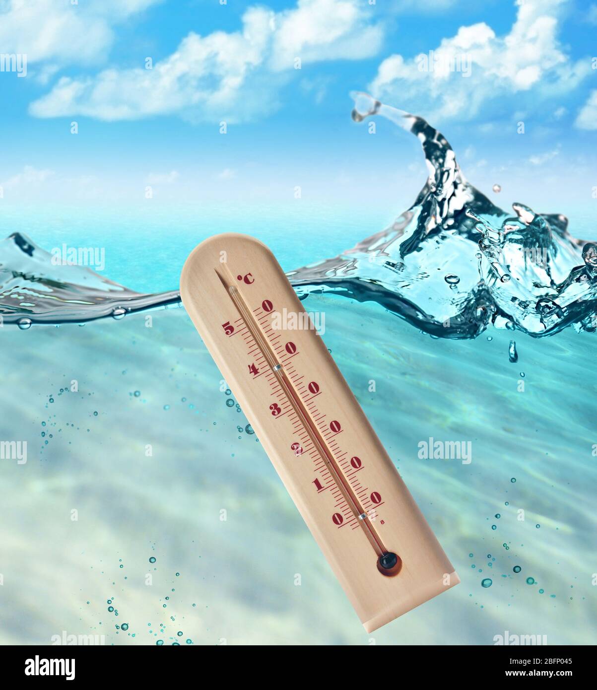 Thermometer showing high temperature and seascape on background ...