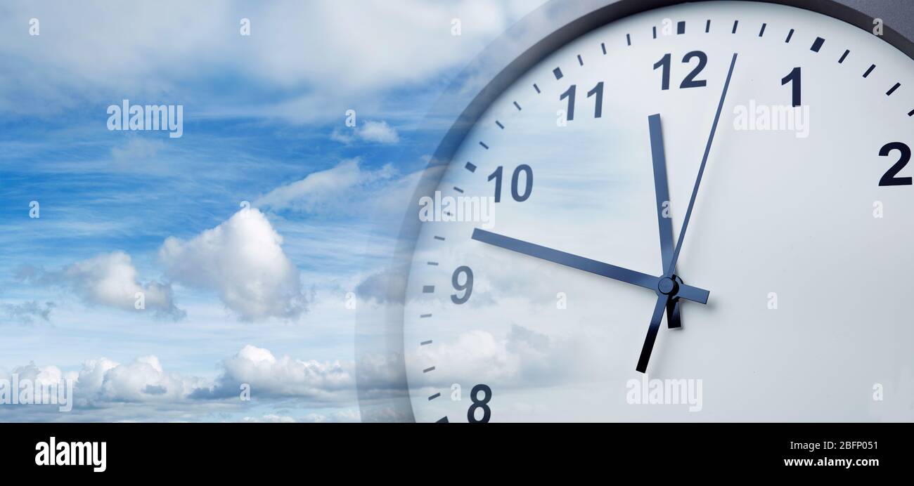 Clock face in blue sky. Time passing Stock Photo - Alamy