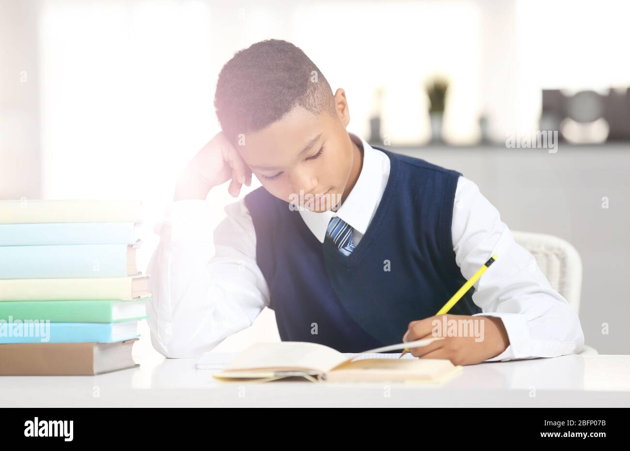 Teenage boy school uniform writing hi-res stock photography and images ...