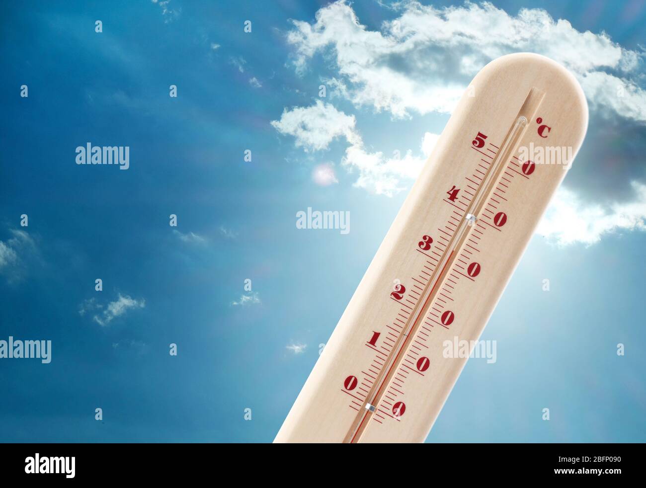 Thermometer showing high temperature and sky on background. Hot summer ...