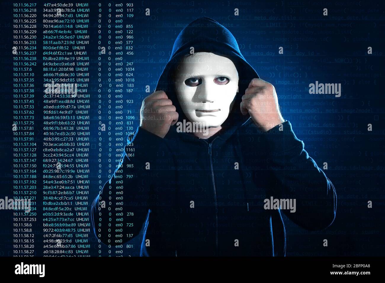 Hacker with mask and code on dark background Stock Photo - Alamy
