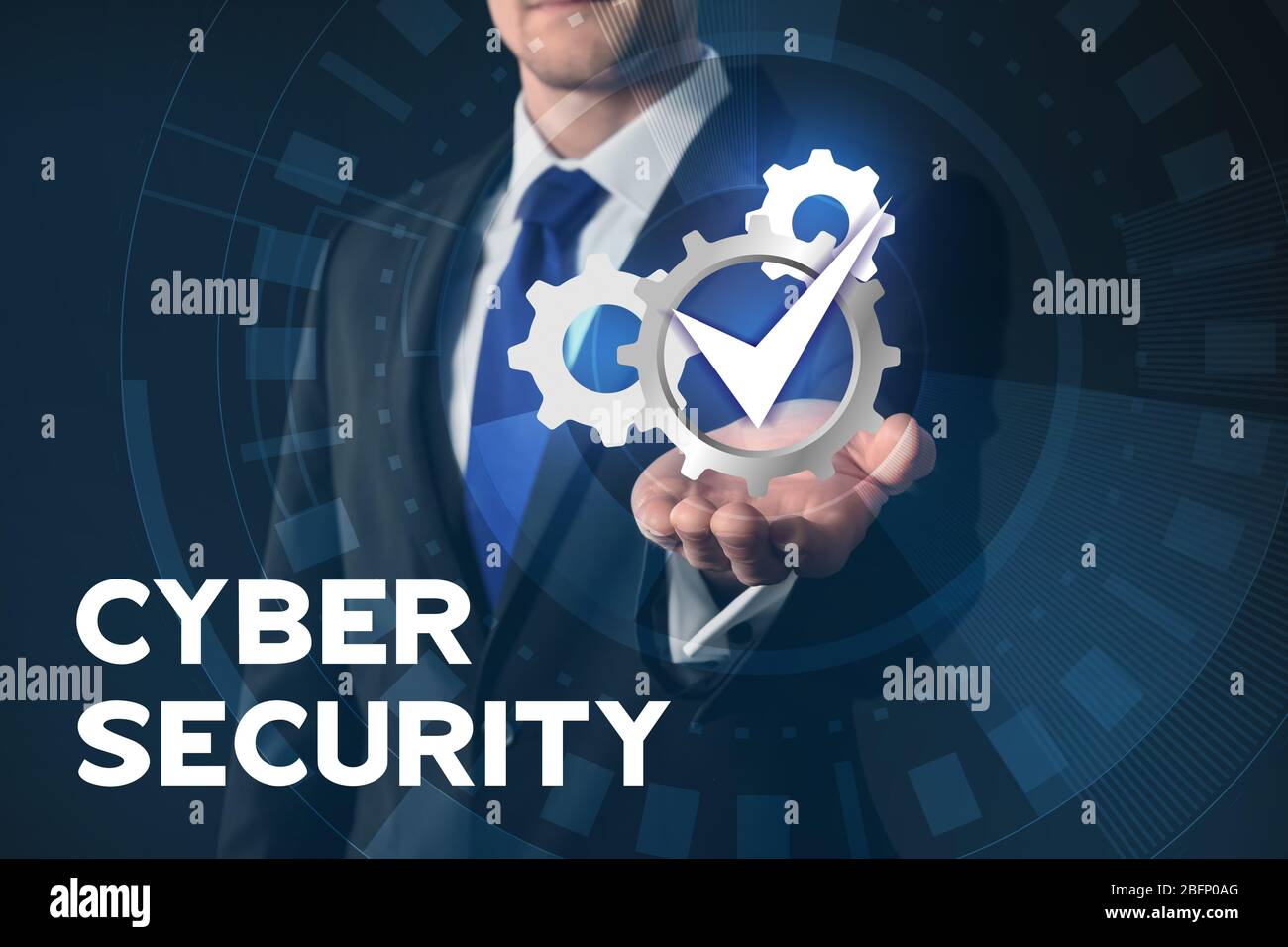 Businessman holding virtual gears and check mark against dark ...