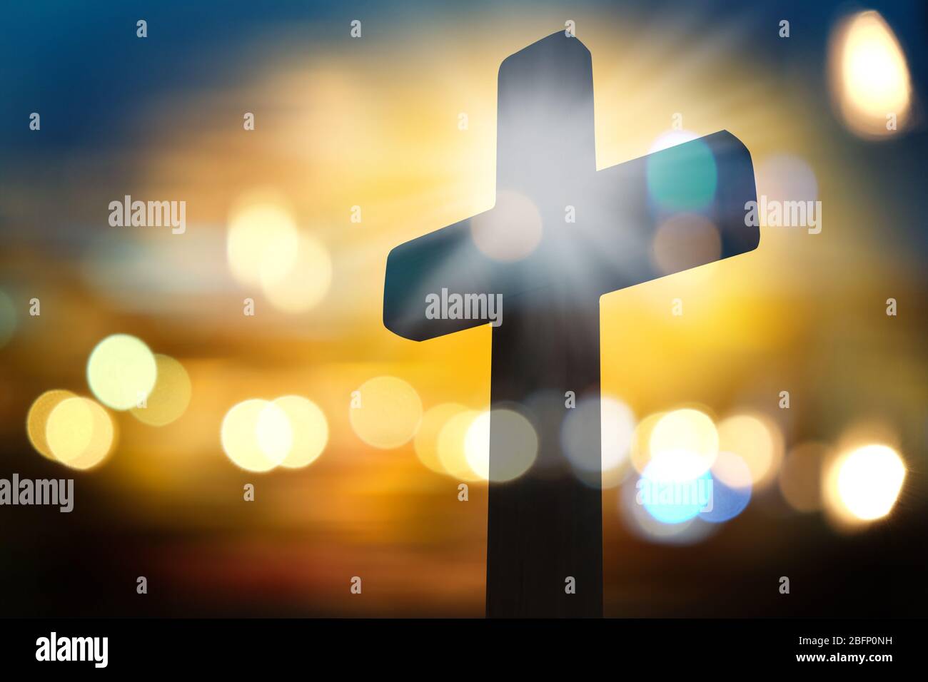 Wooden cross on blurred background. Christian religion Stock Photo - Alamy
