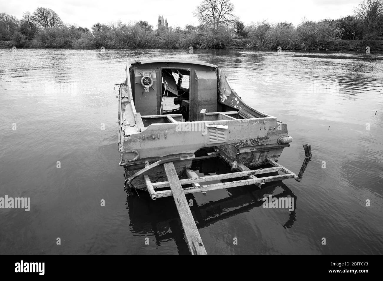 Small river boat sunk during floods Stock Photo - Alamy