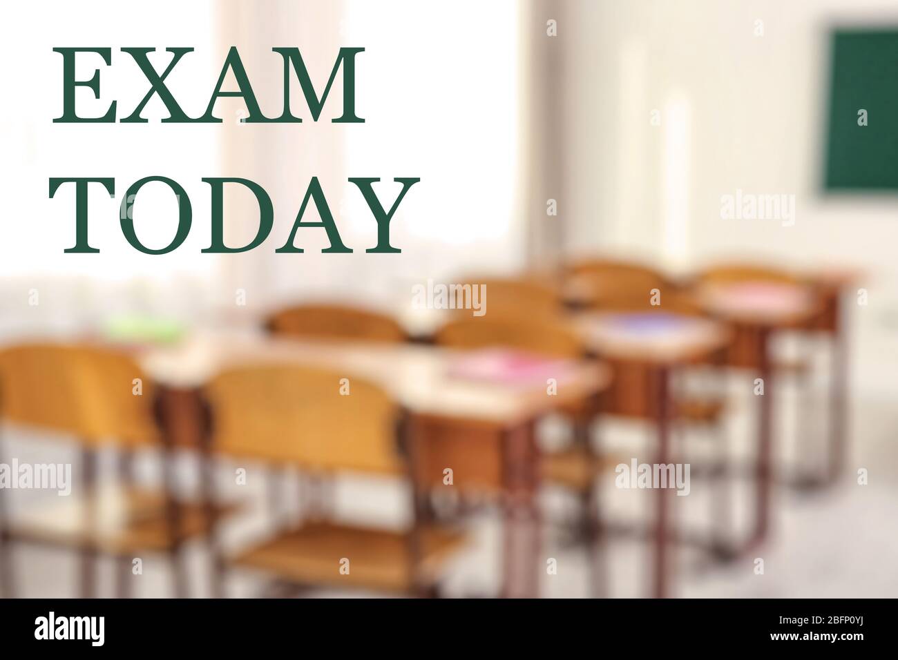 Text EXAM TODAY and blurred view of school classroom interior Stock ...